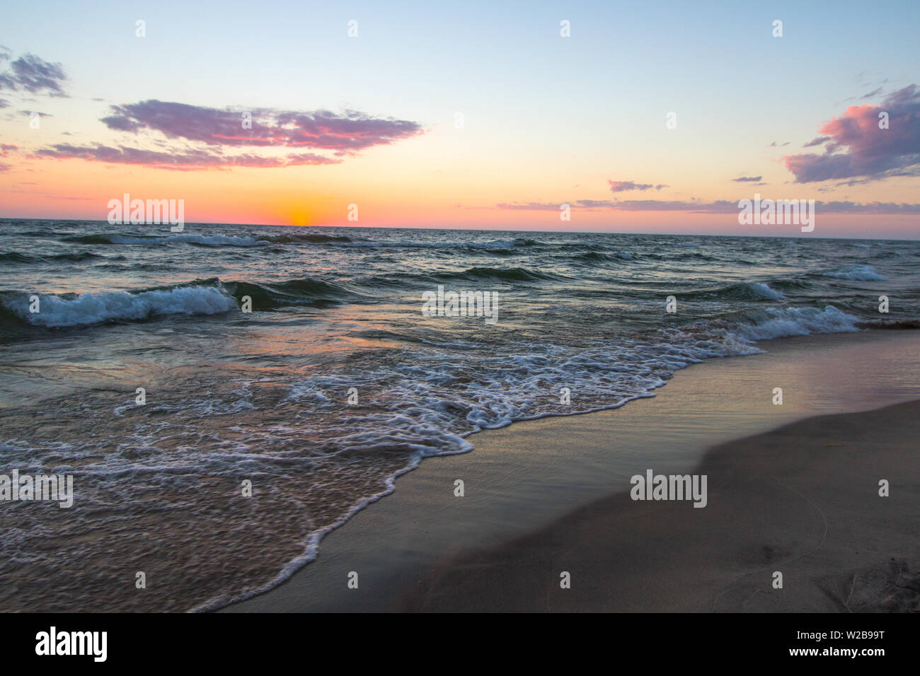 Michigan Summer Beach Sunset Panorama. Sunset horizon reflects off the ...