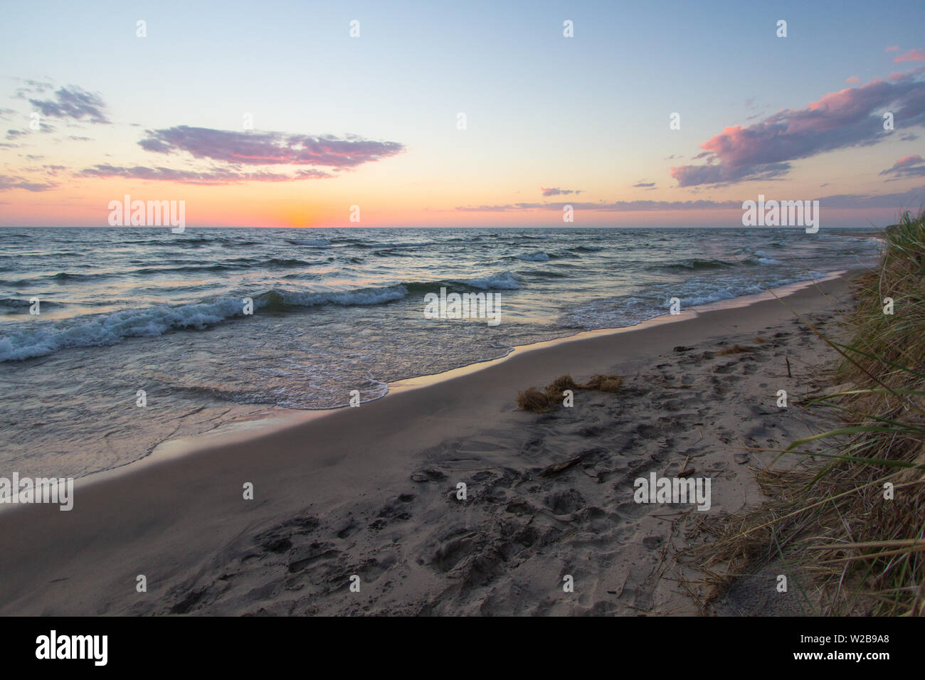 Michigan Summer Beach Sunset Panorama. Sunset horizon reflects off the ...