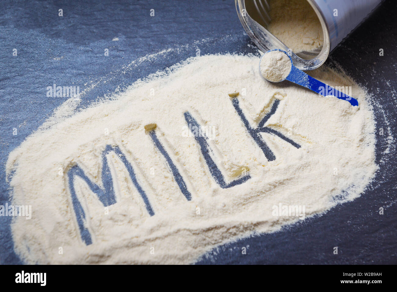 Milk powder on dark background / powdered milk can , food healthy body ...
