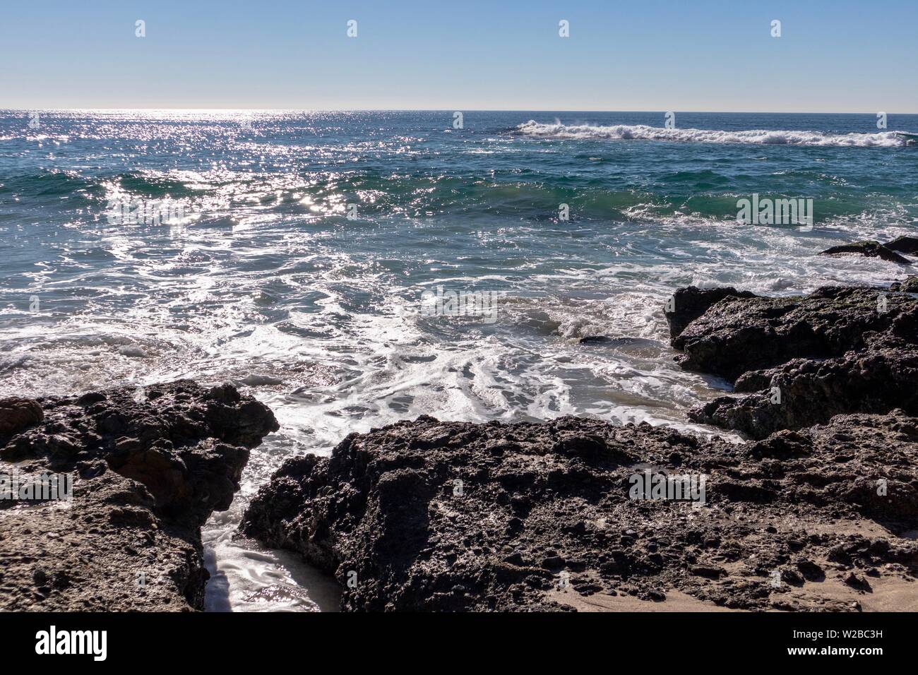 Seascape with rocky beach Stock Photo - Alamy
