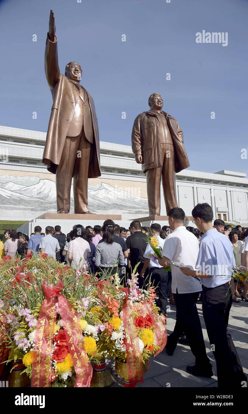 People visit statues of North Korea's founder Kim Il Sung (L) and his ...