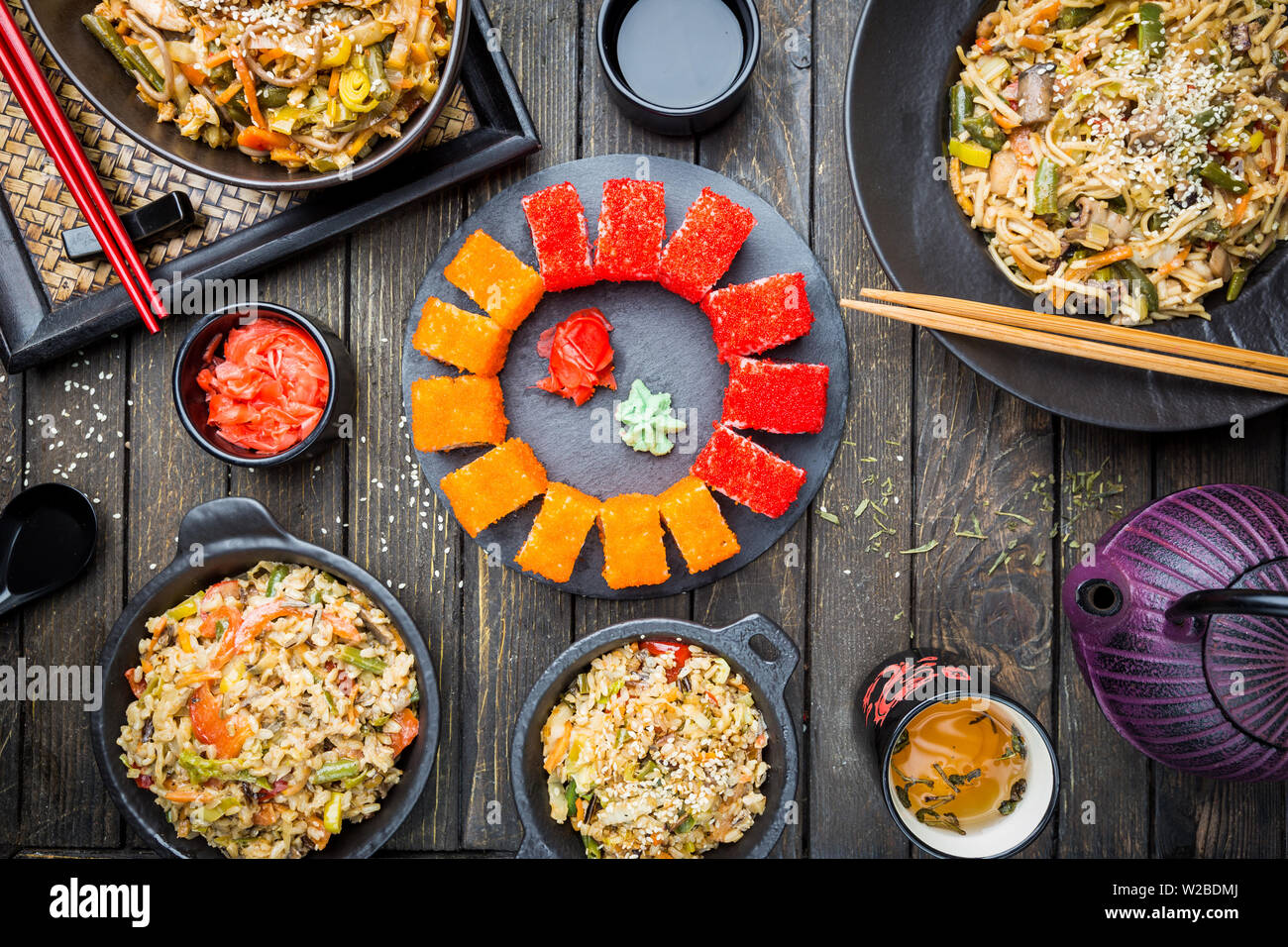 Asian food set served on black wooden background, top view. Chinese ...