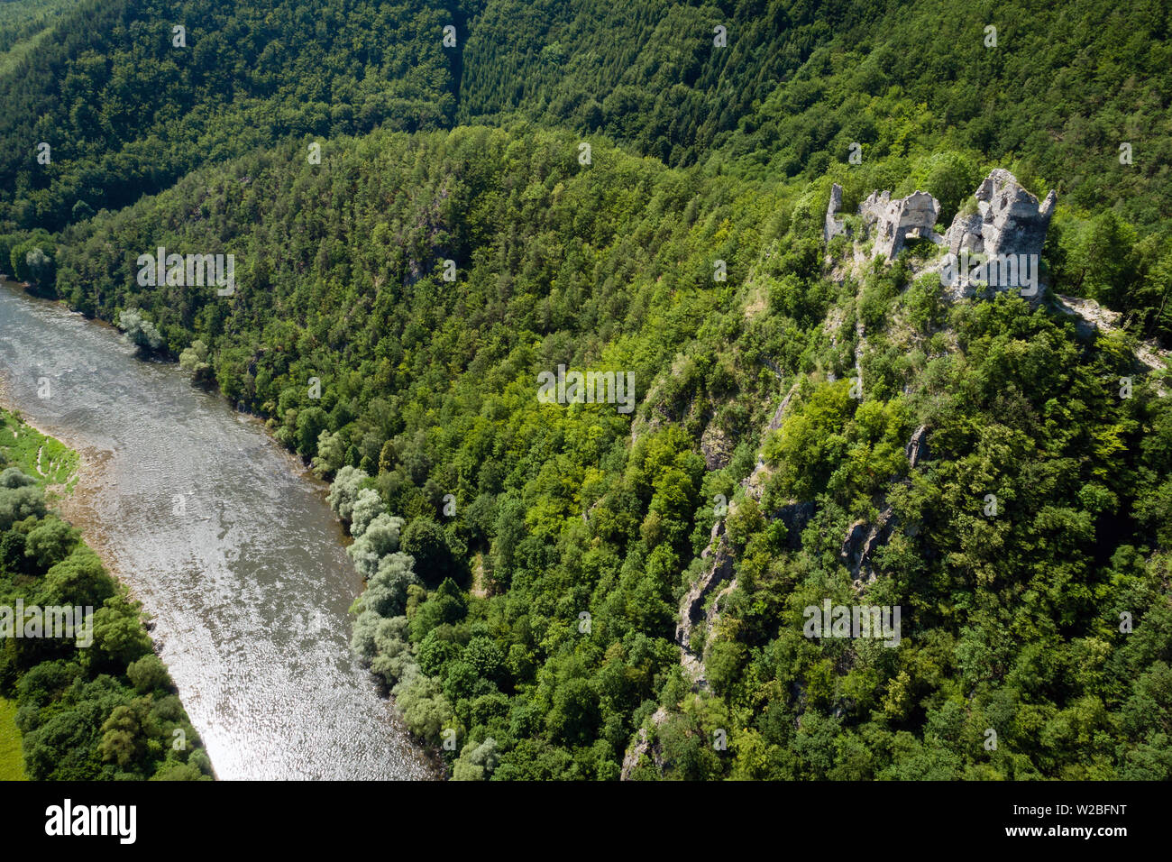 Aerial view of ruins of the Old Strecno castle (Starhrad) and Vah river ...