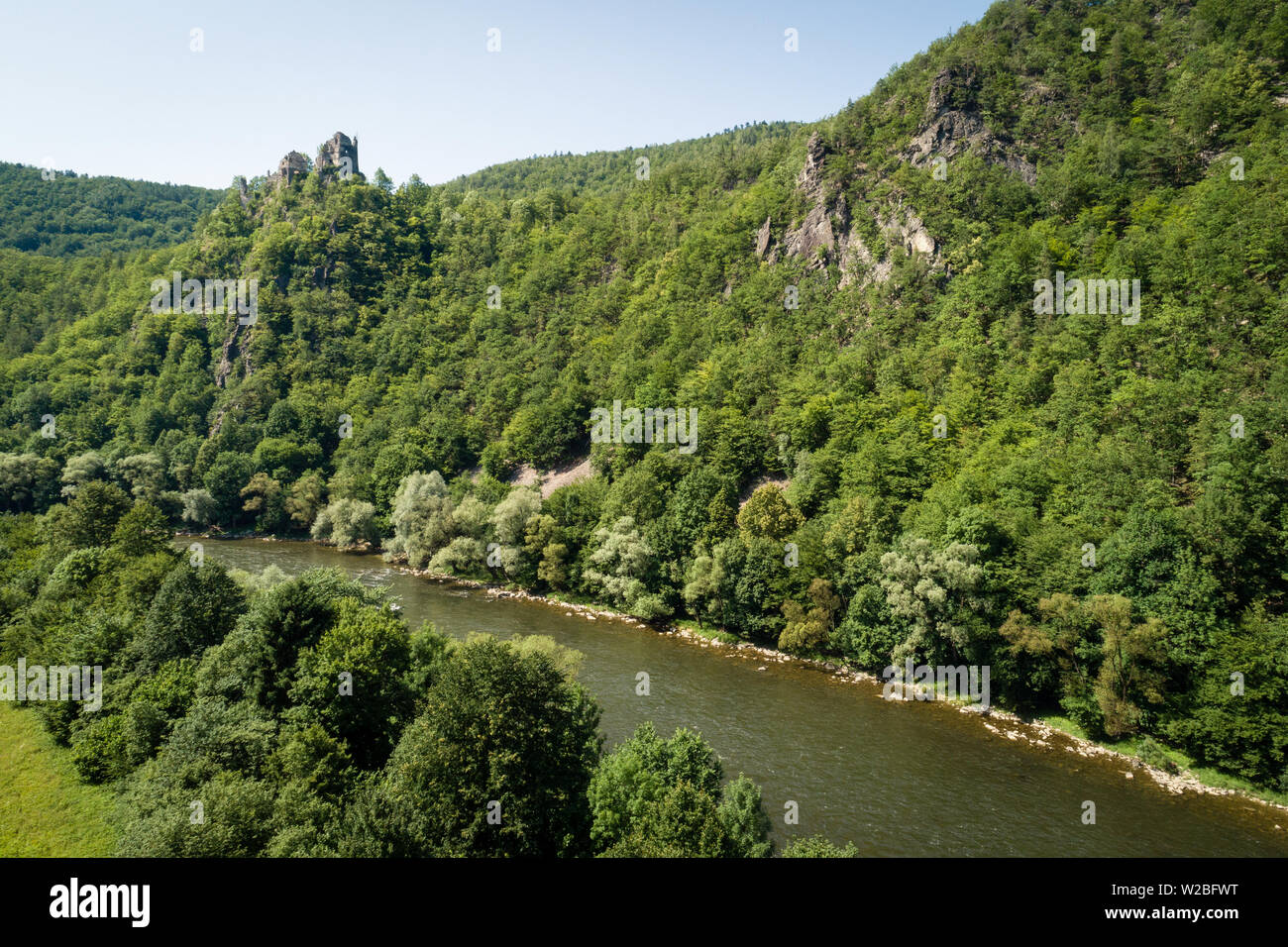 Aerial view of ruins of the Old Strecno castle (Starhrad) and Vah river ...