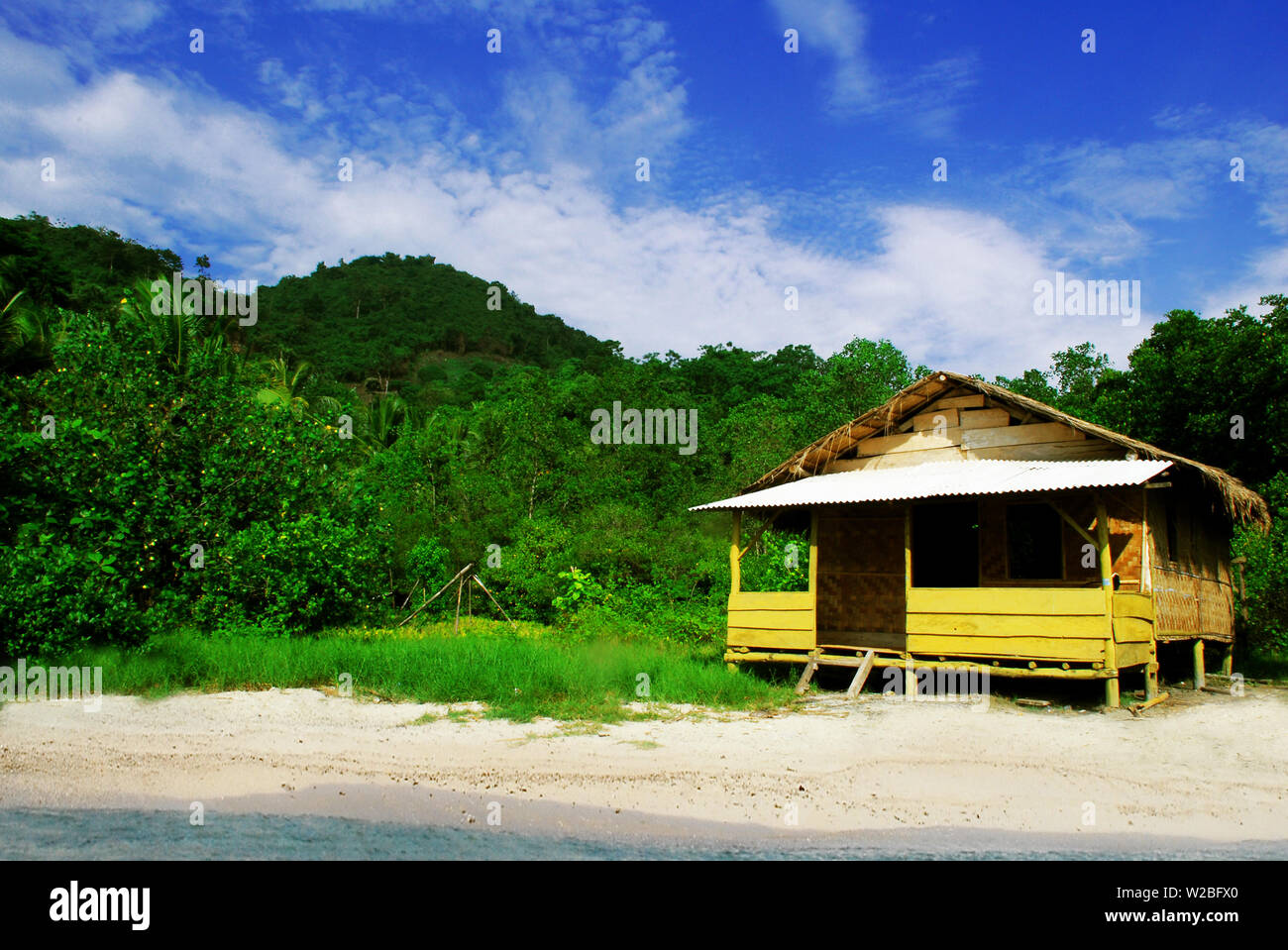 Yellow beach house Stock Photo - Alamy