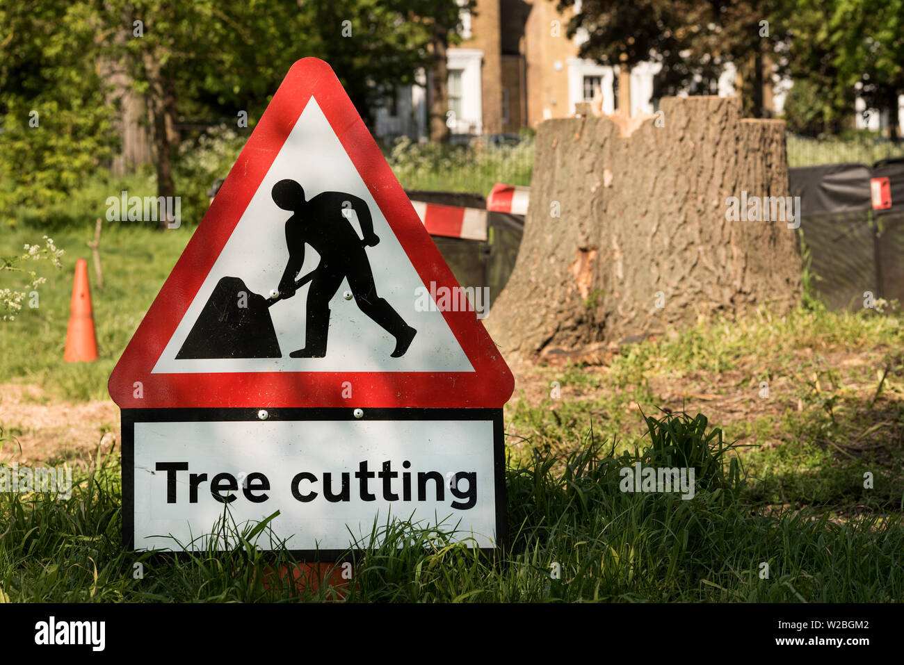 A sign warns of the hazardous area around tree cutting Stock Photo - Alamy