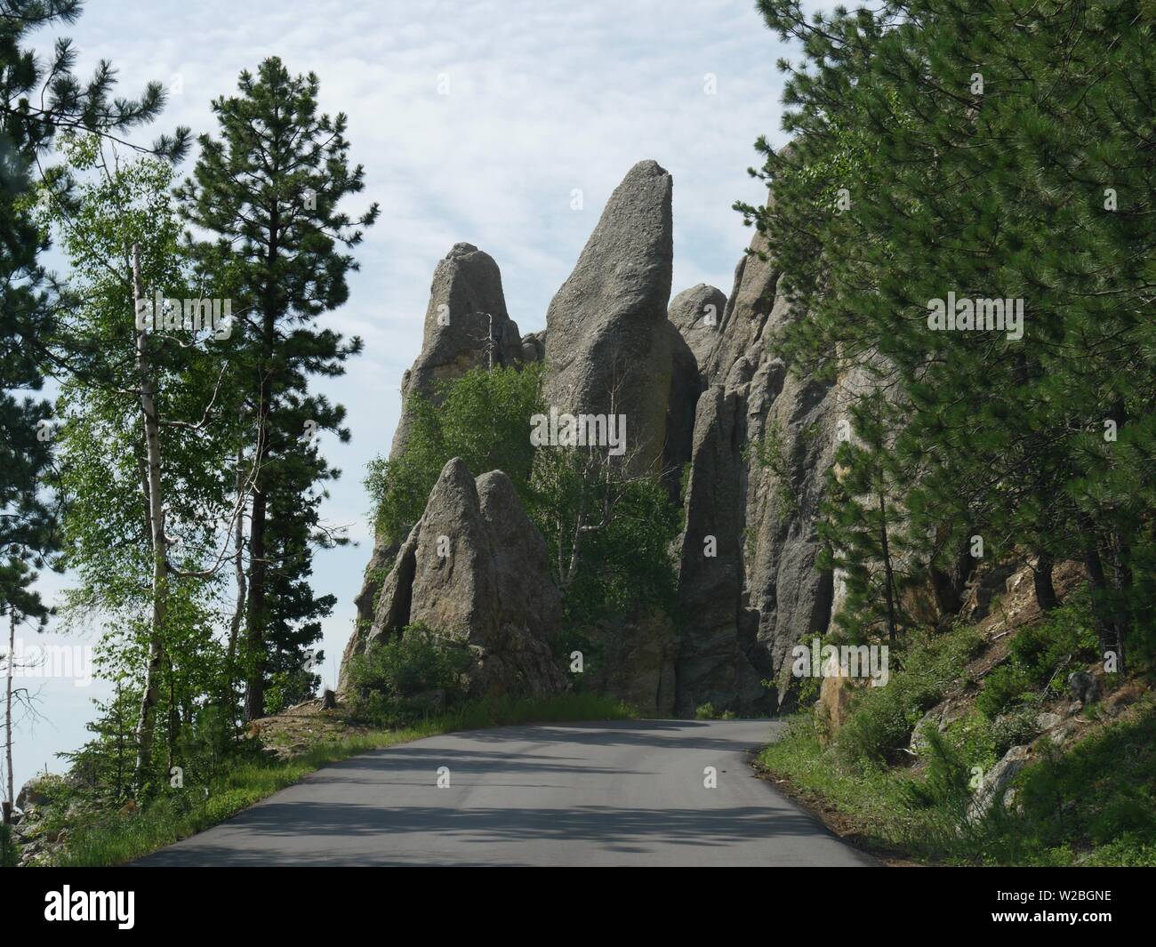 Winding road approaching the Needle's Eye tunnel, an opening created by ...