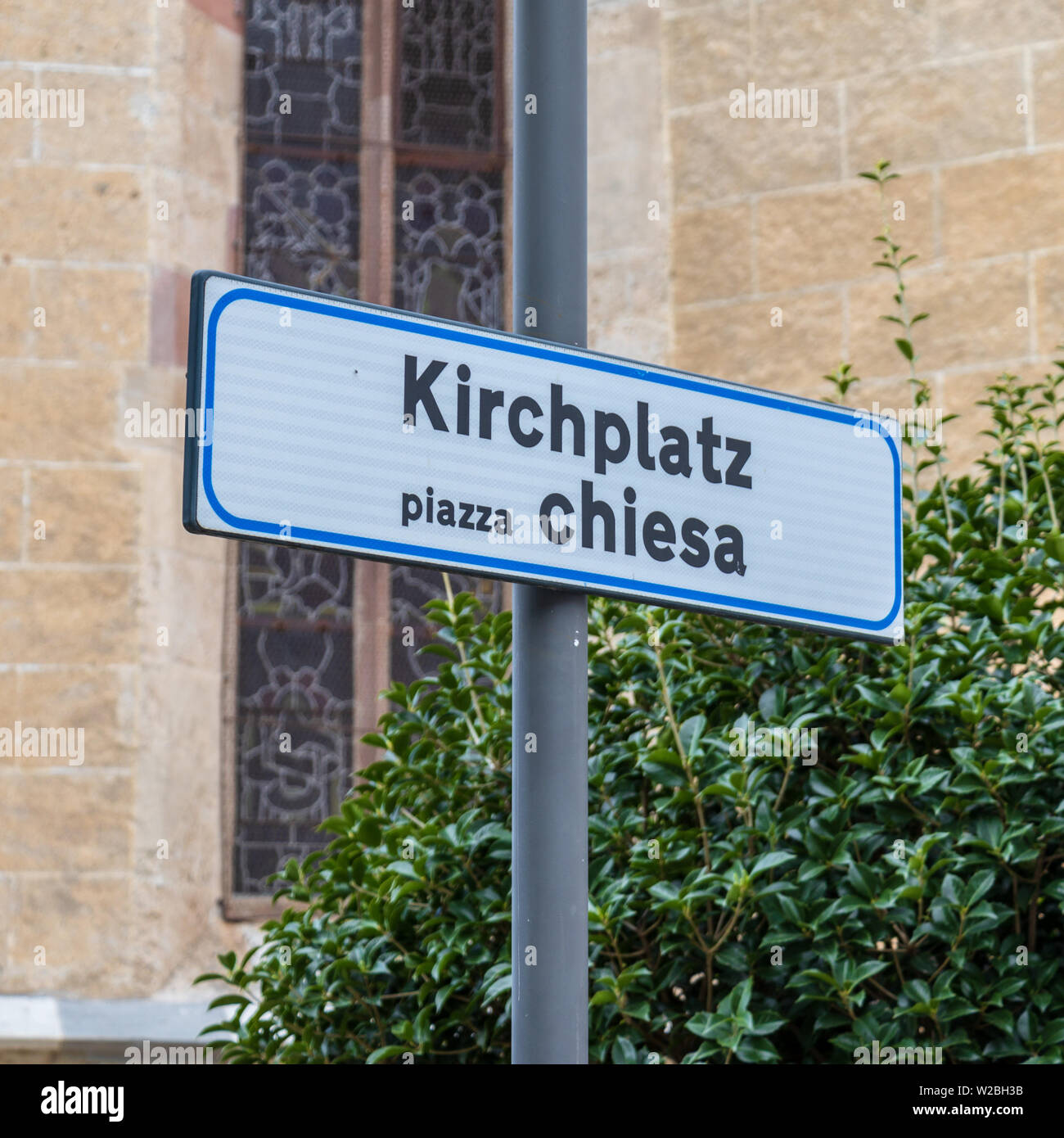 Bilingual Signs lettering Church Square, in german, Kirchplatz, and ...