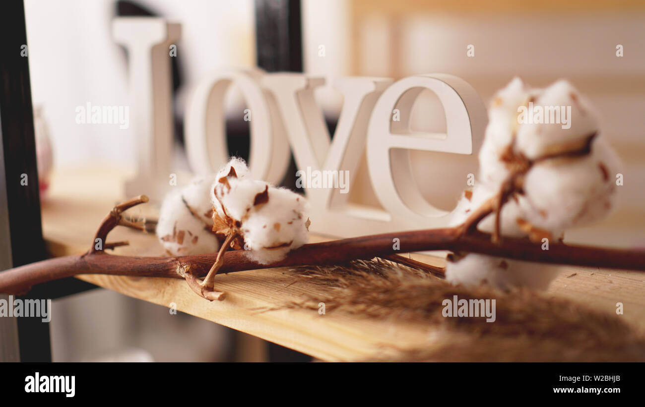 Love wooden letters, vintage styled and cotton flower - blurred ...