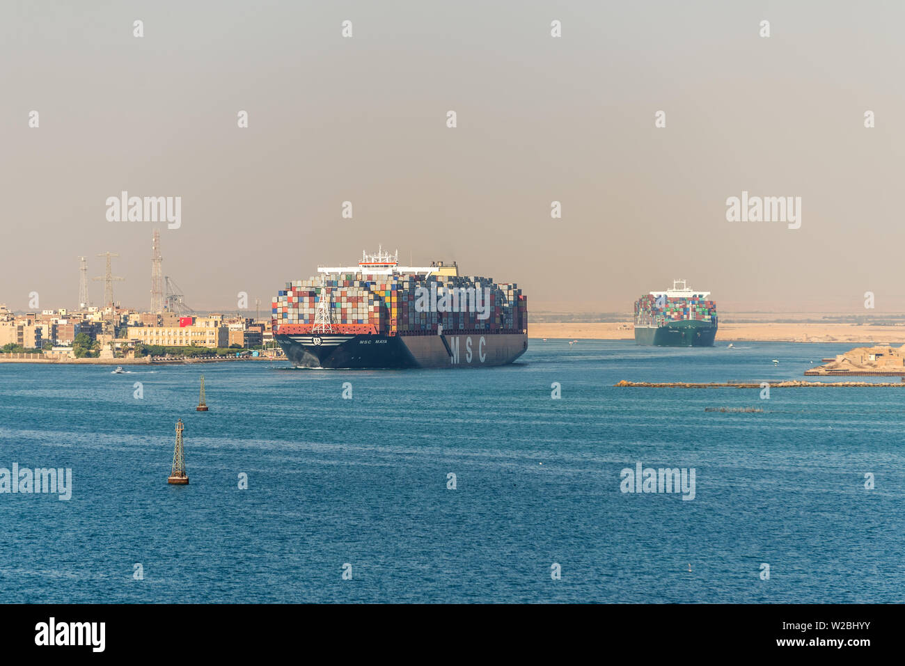 Suez, Egypt - November 5, 2017: Large container vessels (ships) passing ... Suez, Egypt - November 5, 2017: Large container vessels (ships) passing ...