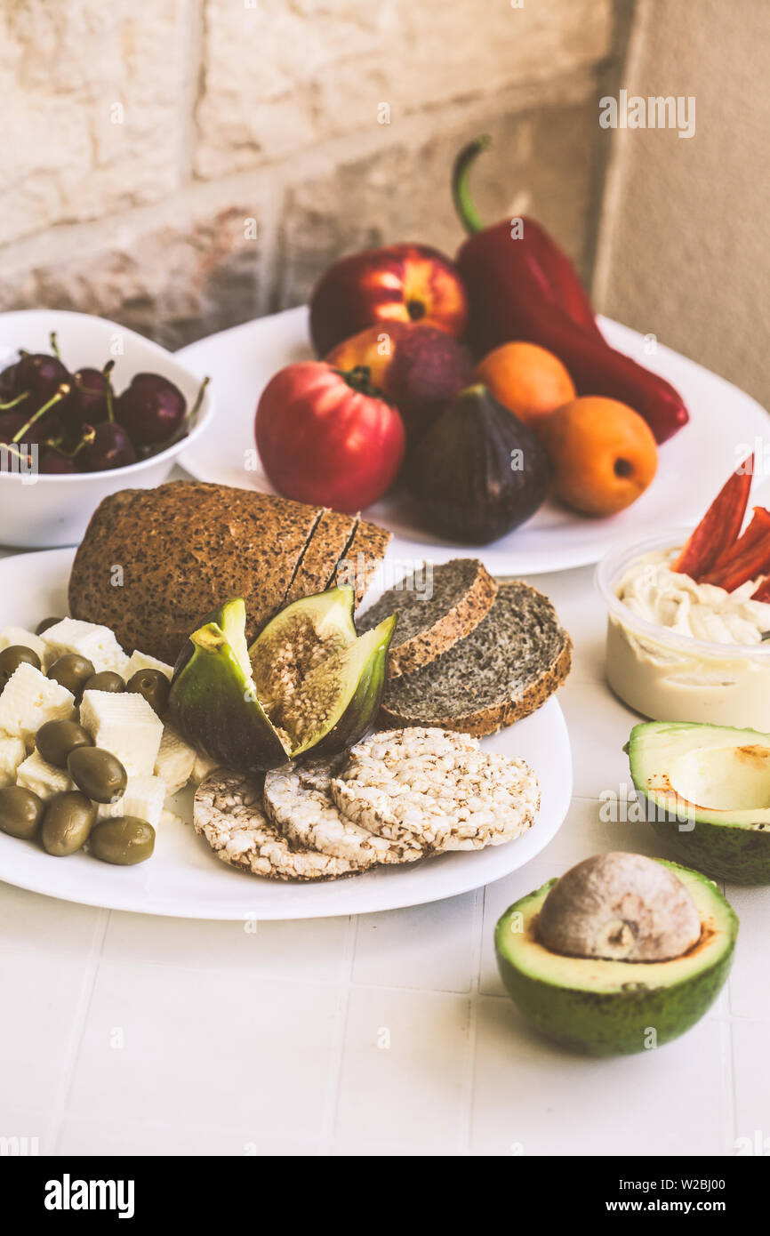 European healthy vegetarian lunch on a white table on the balcony Stock ...