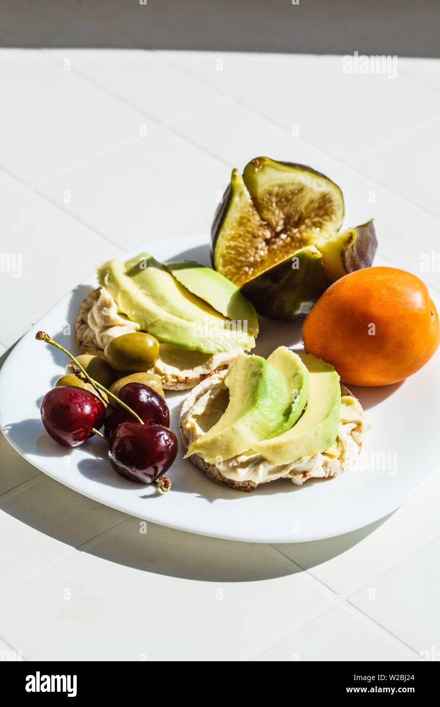 European healthy vegetarian lunch on a white table on the balcony Stock ...