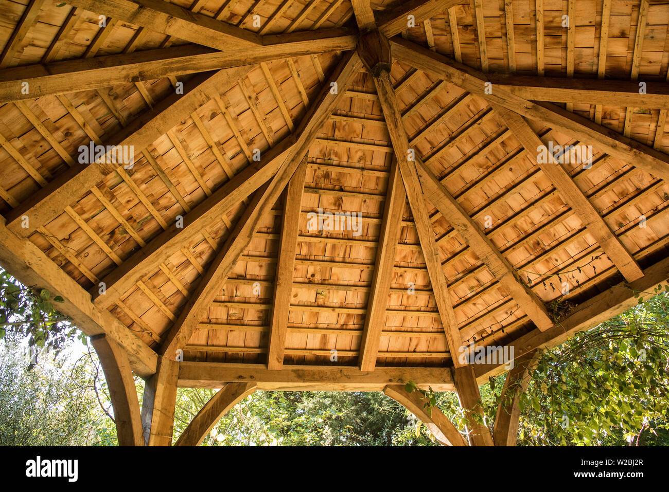 The roof of an open-sided gazebo offering shelter from the scorching ...