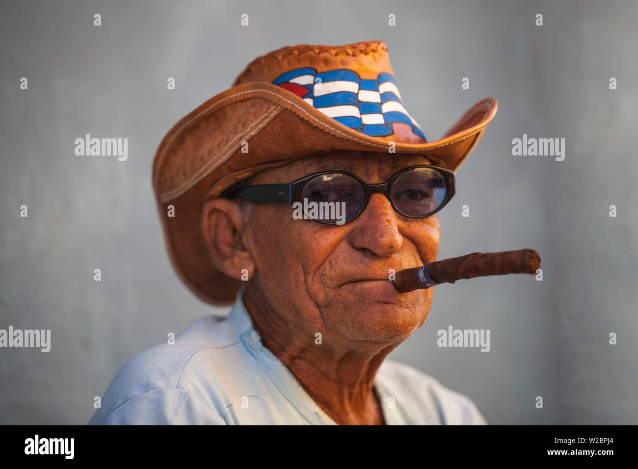 Portrait of cuban man smoking cigar trinidad hi-res stock photography ...