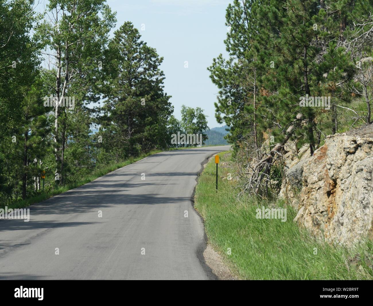 Scenic drive along a winding sloping road at Needles Highway in South ...