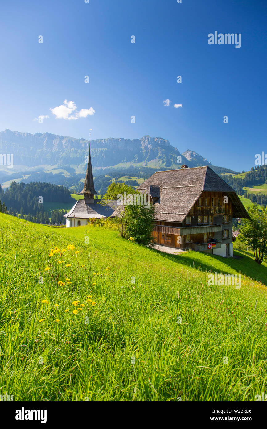 Church and farmhouse in a village in the Emmental Valley, Berner ...