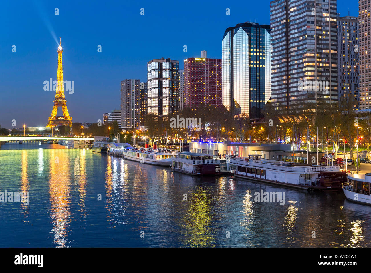 Night view of River Seine with high-rise buildings on the Left Bank ...