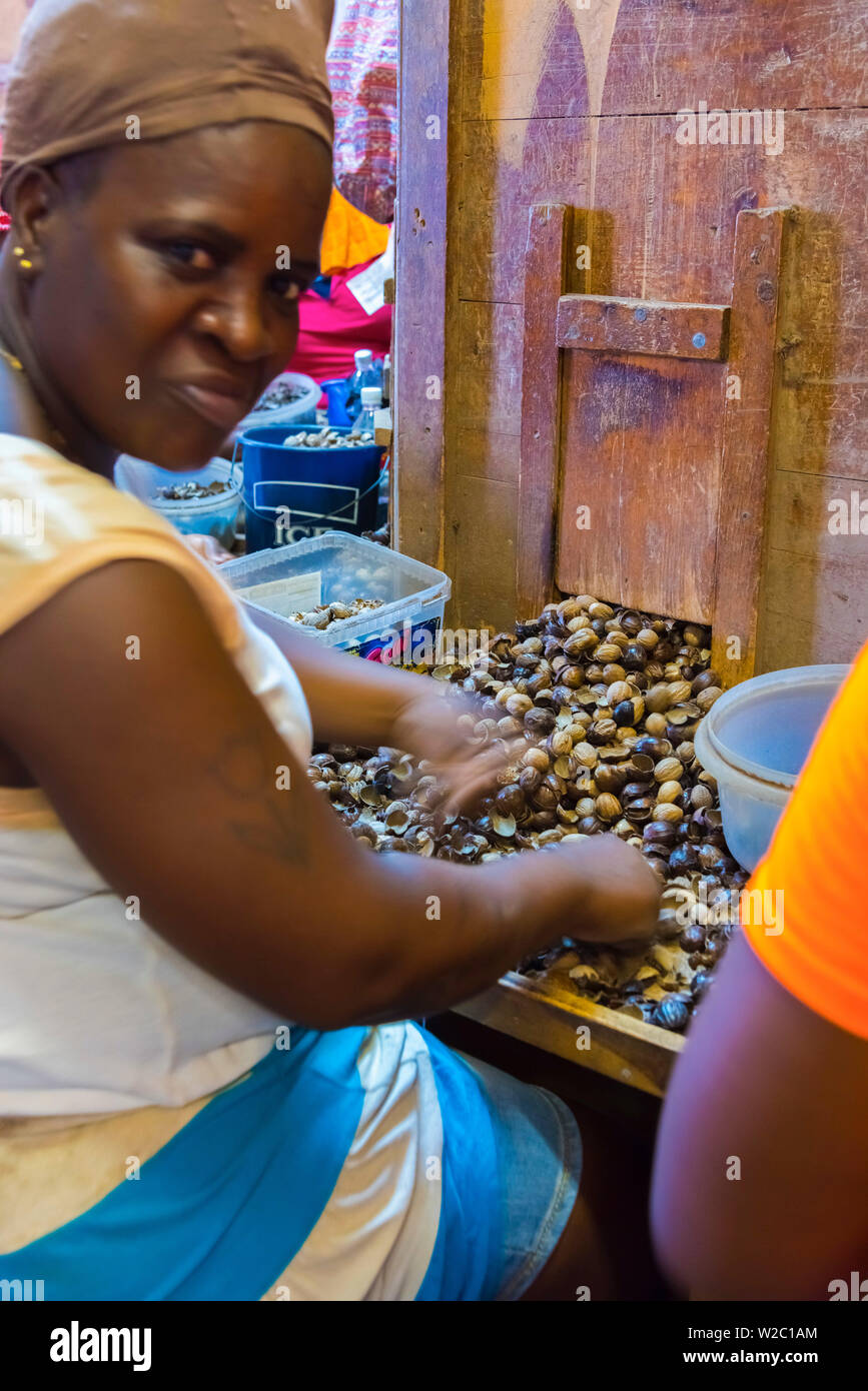 Woman sorting nutmeg hi-res stock photography and images - Alamy