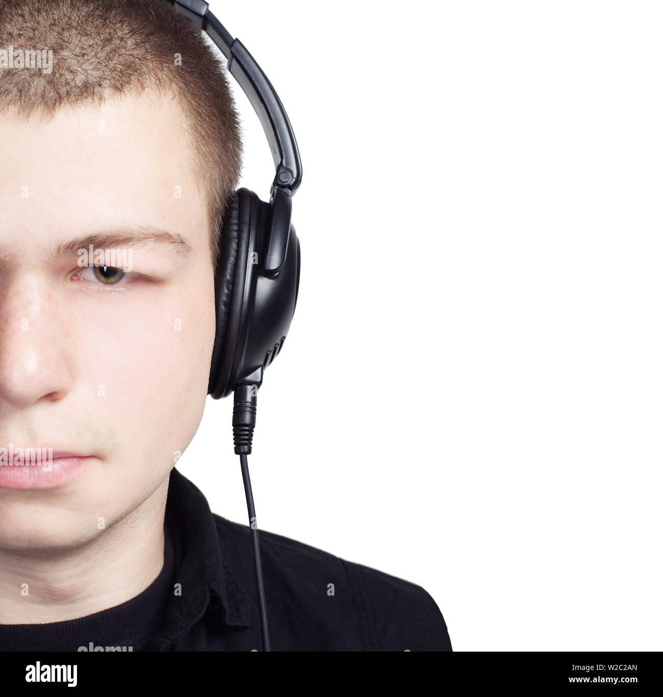 Face young man with headphones on head on a white background Stock ...