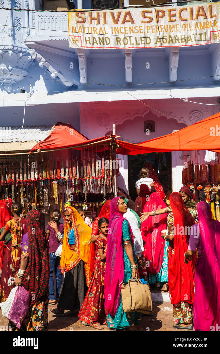 India, Rajasthan, Pushkar, Women shopping in bazaar shops at Camel Fair ...