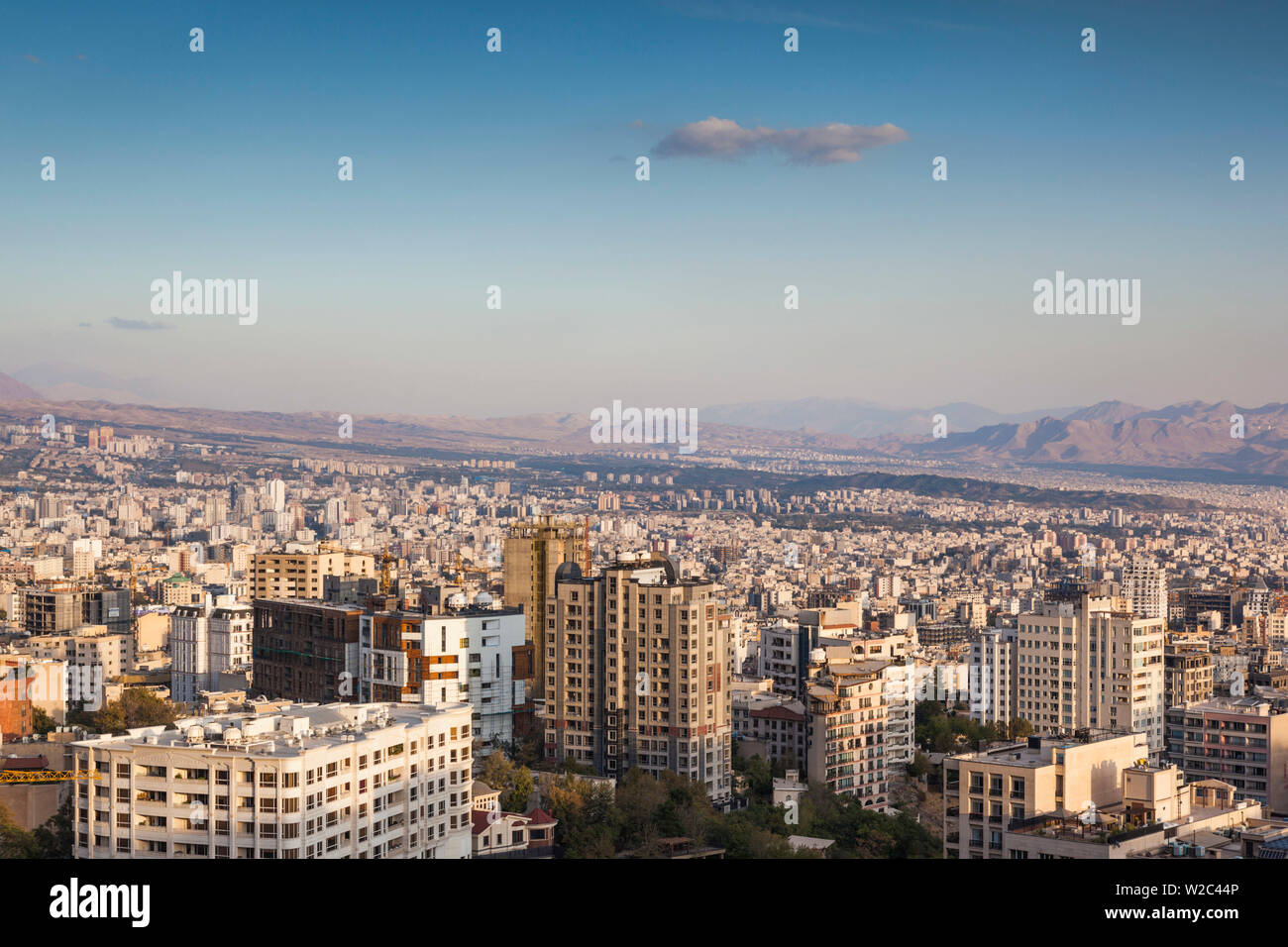 Iran, Tehran, elevated city skyline from the Roof of Iran park, sunset ...