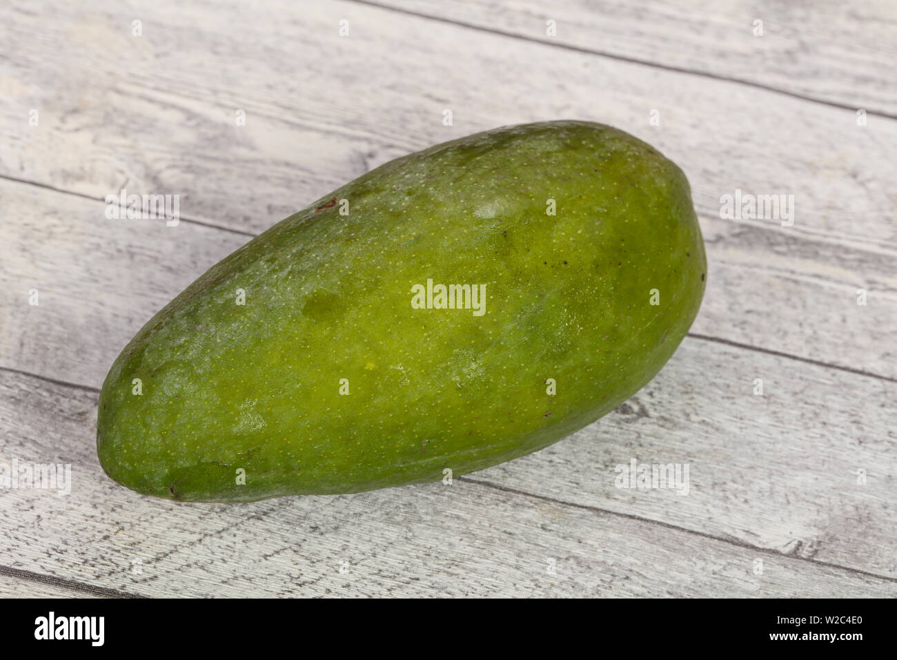 Green tasty mango over background Stock Photo - Alamy