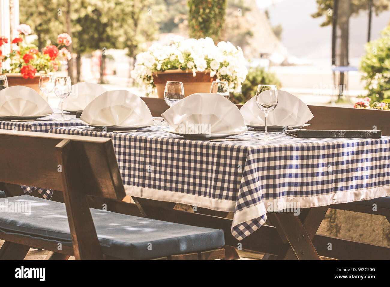 Serving at a European restaurant on the street, menu and table Stock ...