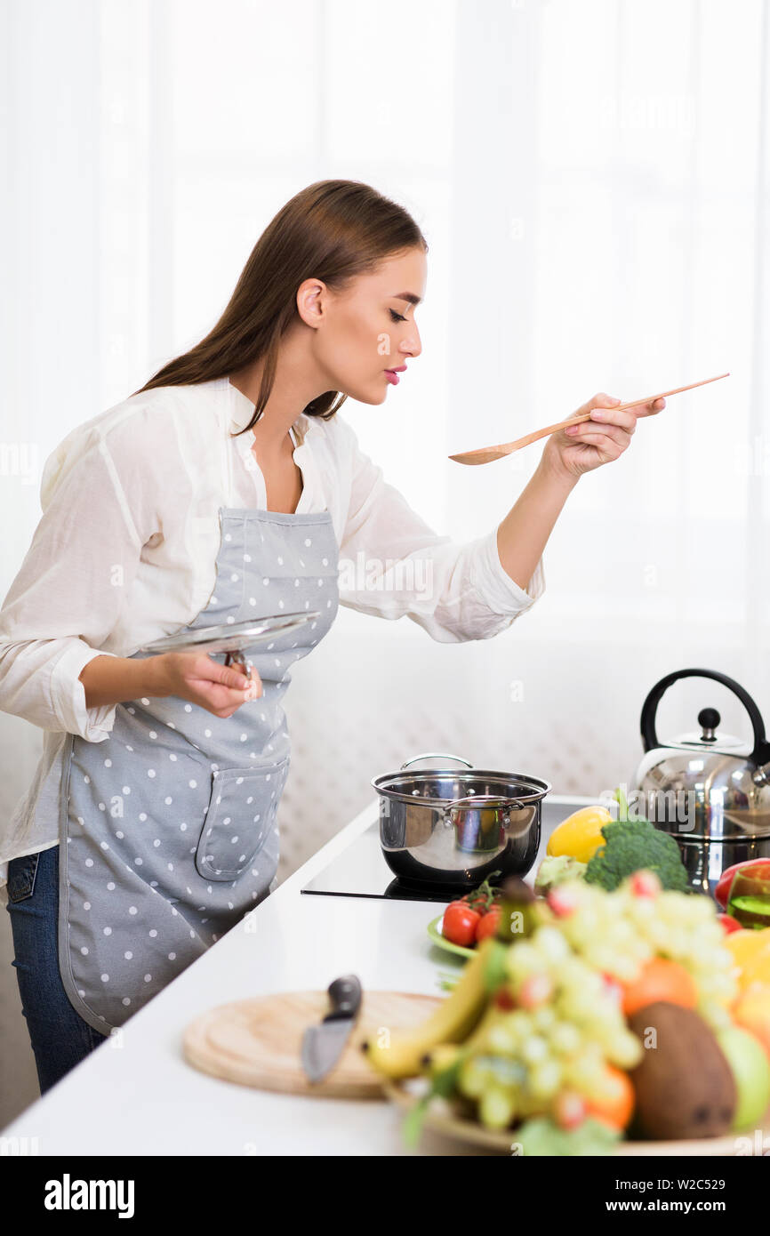 Spoon woman try pot hi-res stock photography and images - Alamy