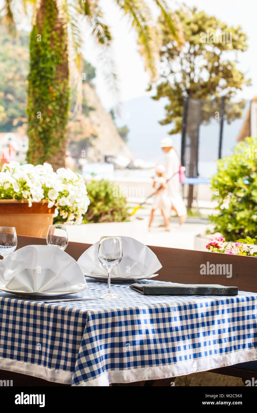 Serving at a European restaurant on the street, menu and table Stock ...