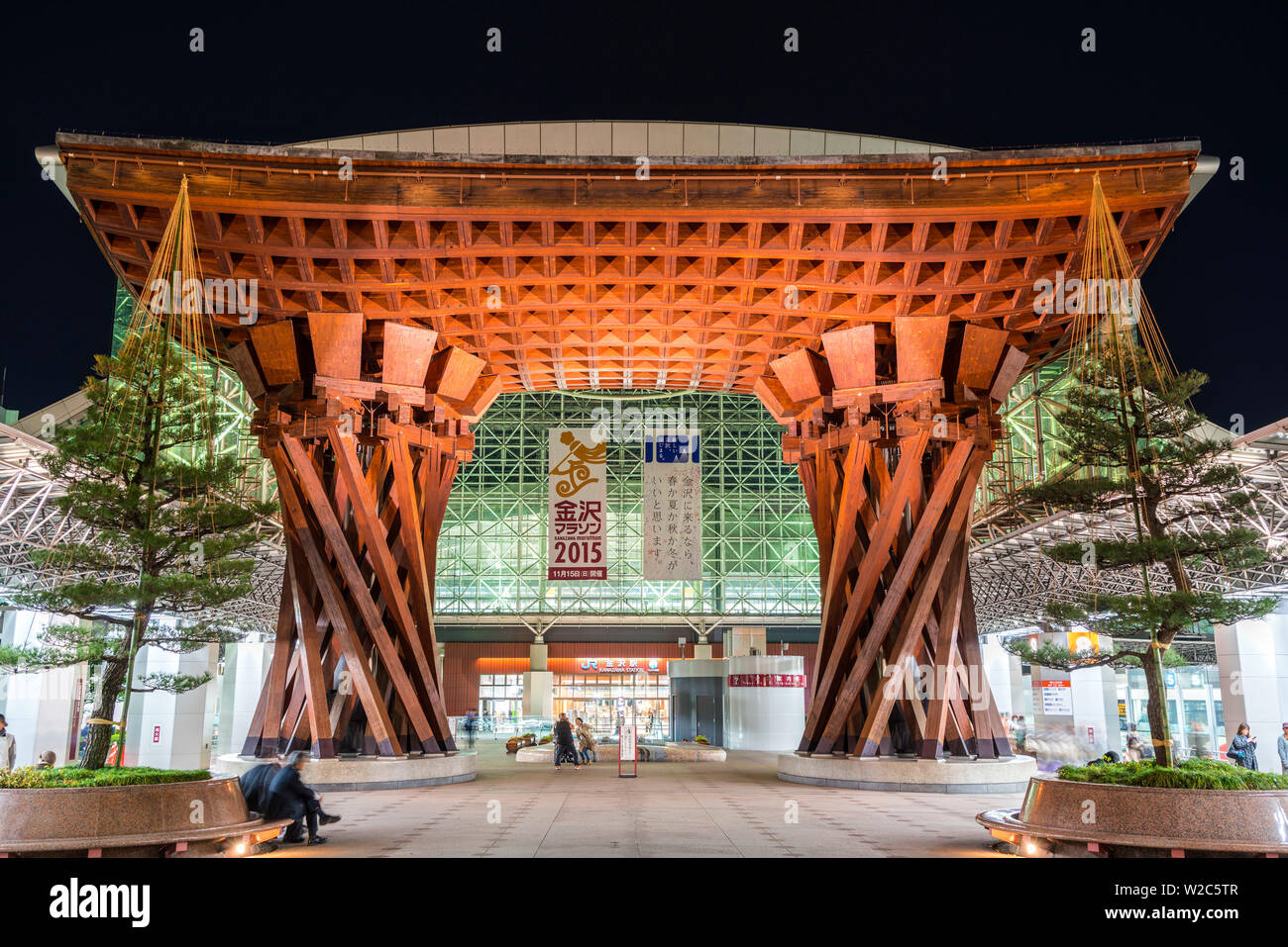 Night view of huge wooden gate marking the entrance to Kanazawa JR ...