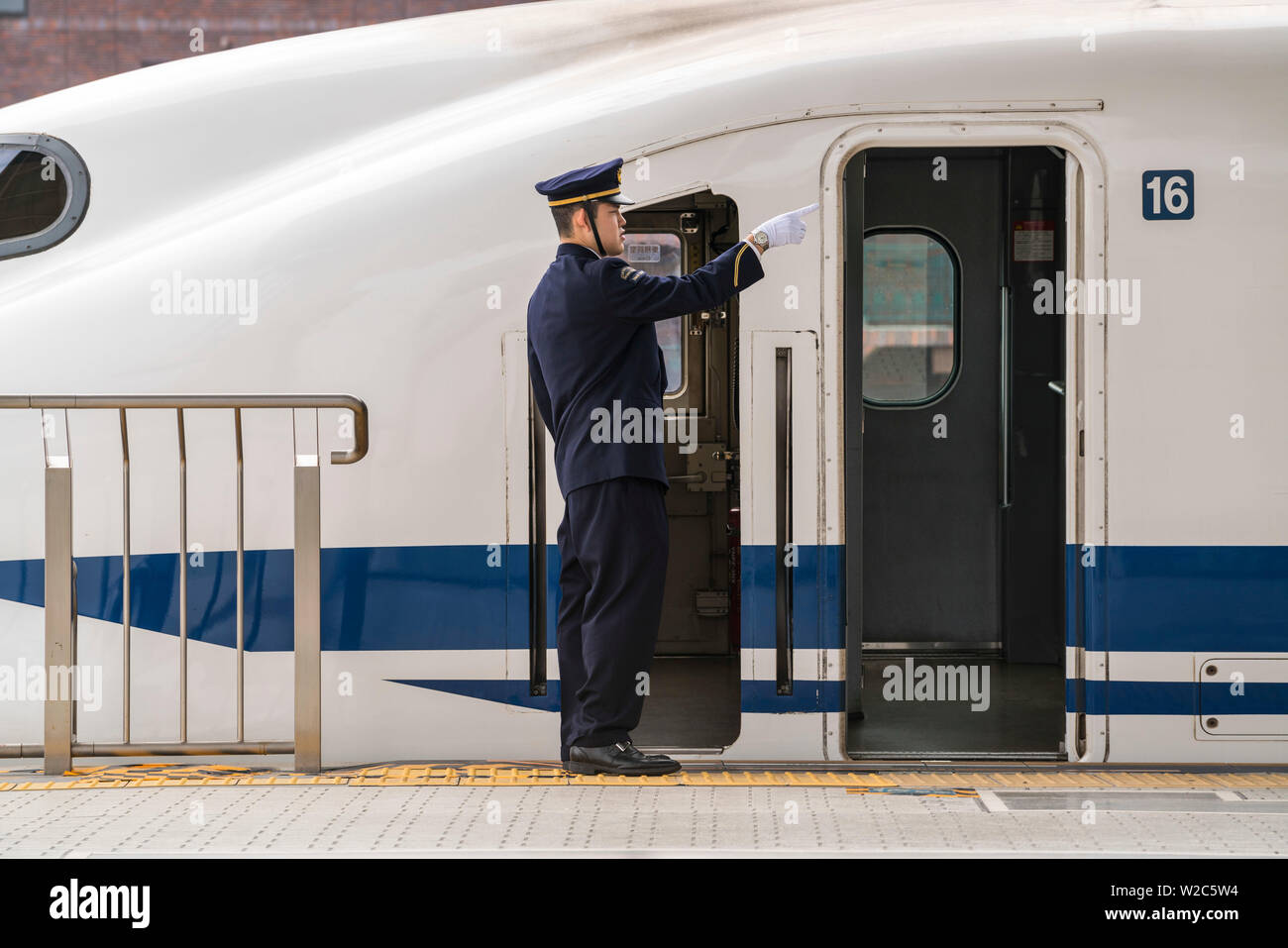 Train guard on bullet train hi-res stock photography and images - Alamy