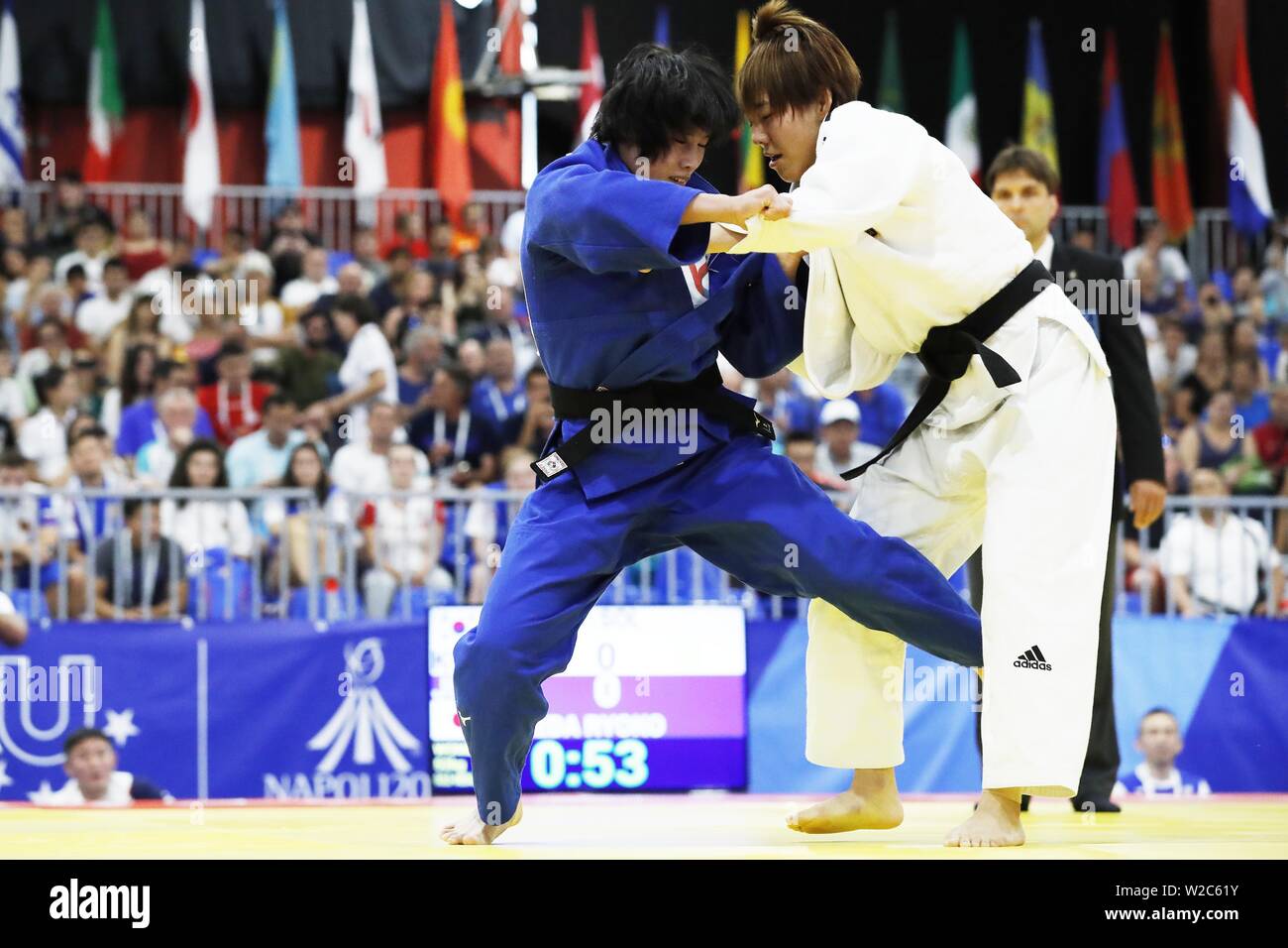 Ryoko Takeda of Japan, blue, fights against Park Da-sol of South Korea ...