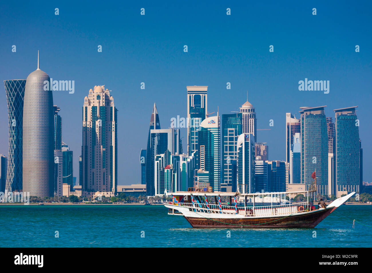 Qatar, Doha, Dhows on Doha Bay with West Bay skyscrapers Stock Photo ...
