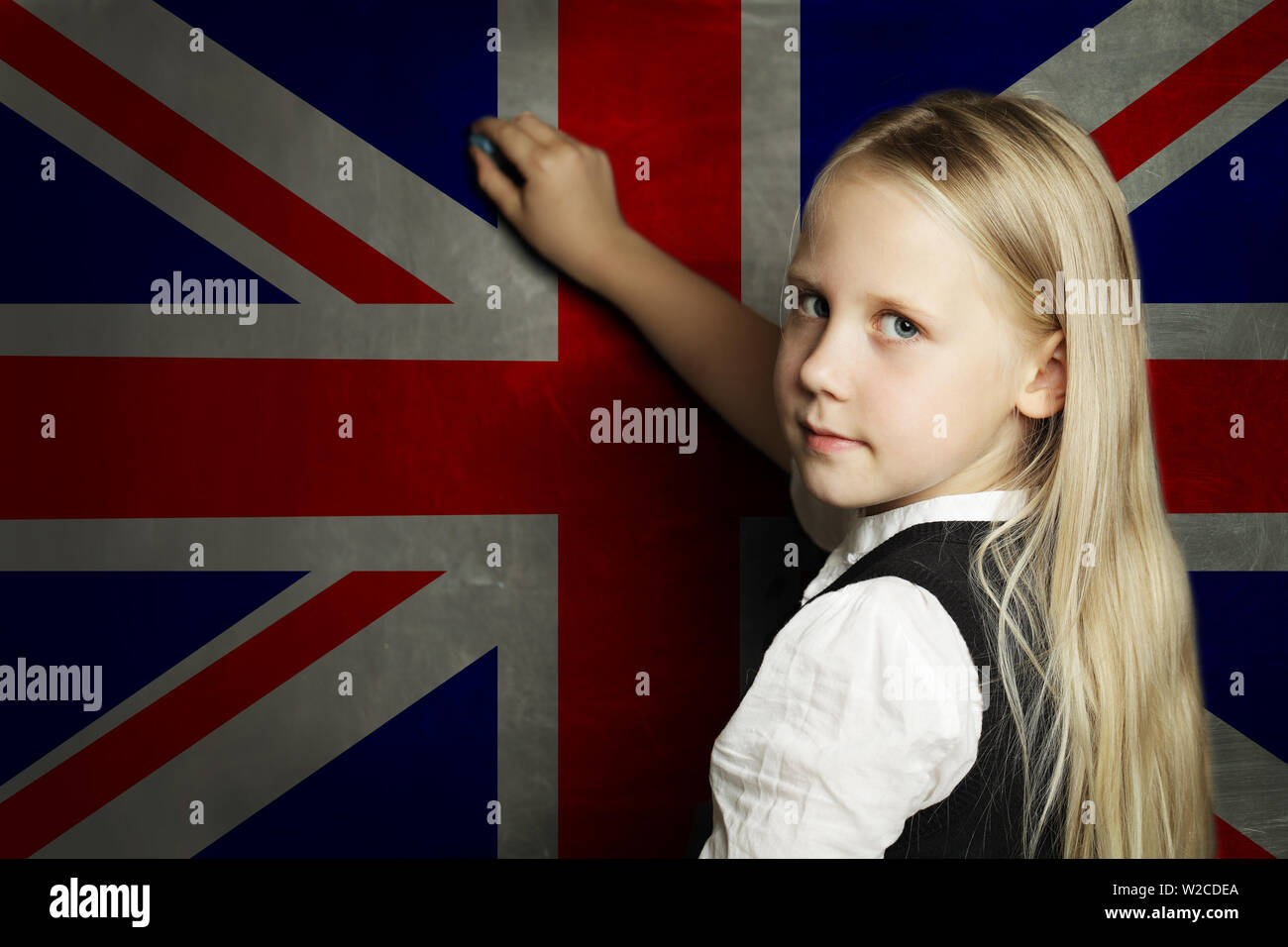 Cute child girl student against the UK flag background. English ...
