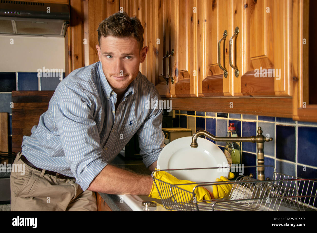 Person washing white plates sponge hi-res stock photography and images ...