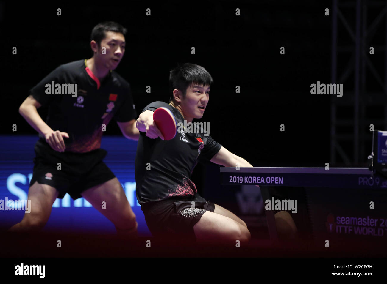 Xu Xin and Fan Zhendong of China return a shot to Jeoung Youngsik and Lee Sangsu of South Korea ...