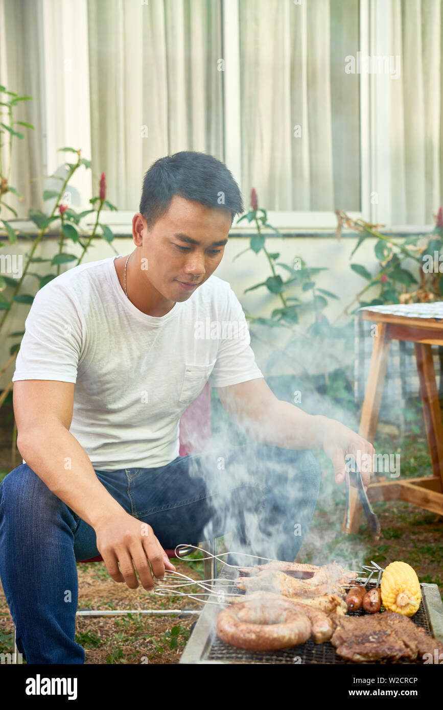 Man sitting near fire indoors hi-res stock photography and images - Alamy