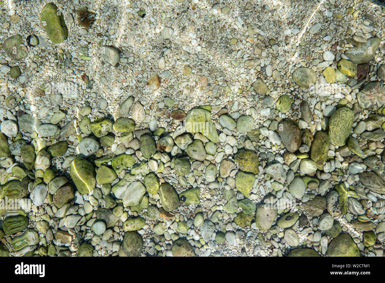 Sunshine sea and pebbles hi-res stock photography and images - Alamy