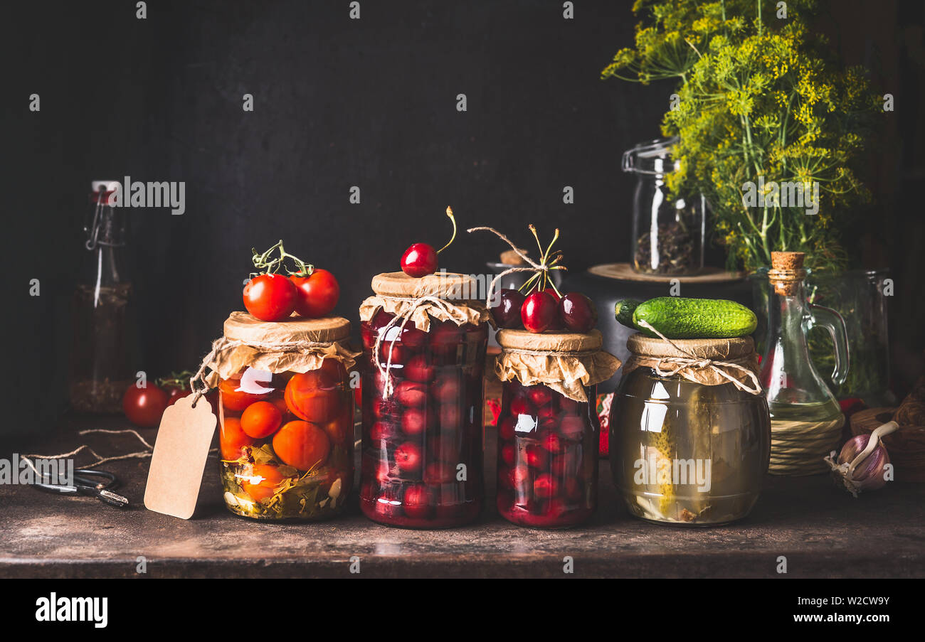 Preserved and fermented food in glass jars - pickles, jam, compote with ...
