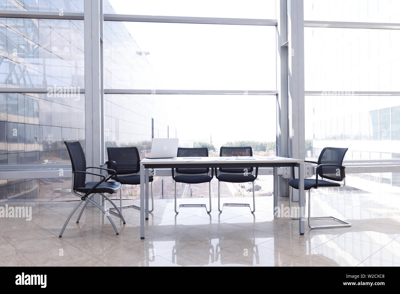 No people , empty conference table in office with panoramic windows ...