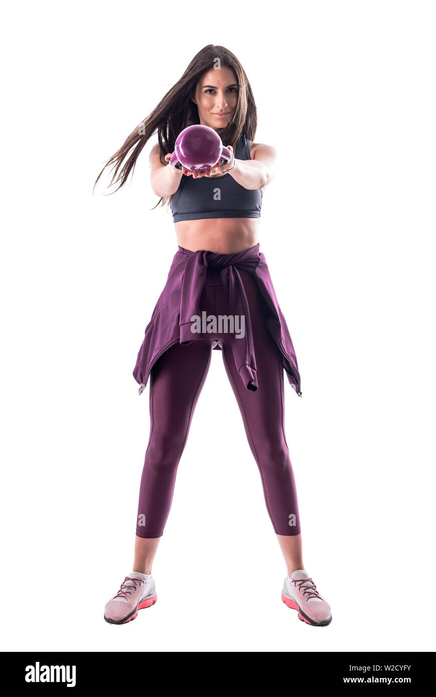 Mid air action photo of young fitness woman model exercising with ...