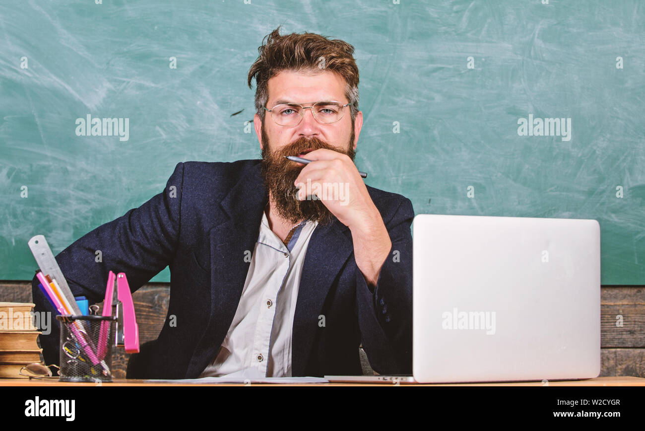 Pay attention to details. Teacher concentrated bearded mature ... Pay attention to details. Teacher concentrated bearded mature ...