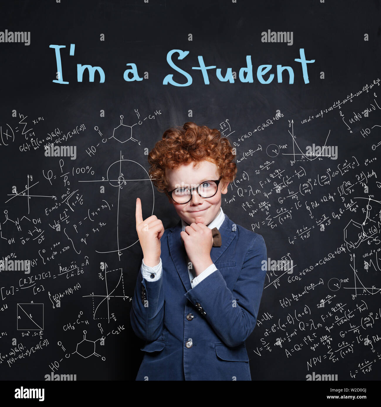 Smart child student in classroom on chalkboard background, Back to ...