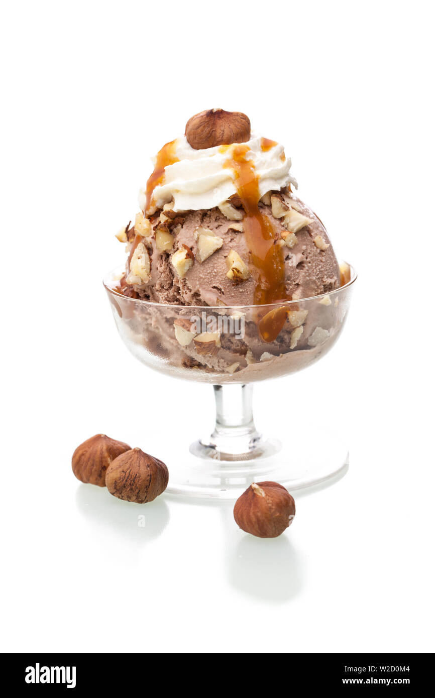 ice cream sundae: haselnut ice cream scoop with whipped cream and ...
