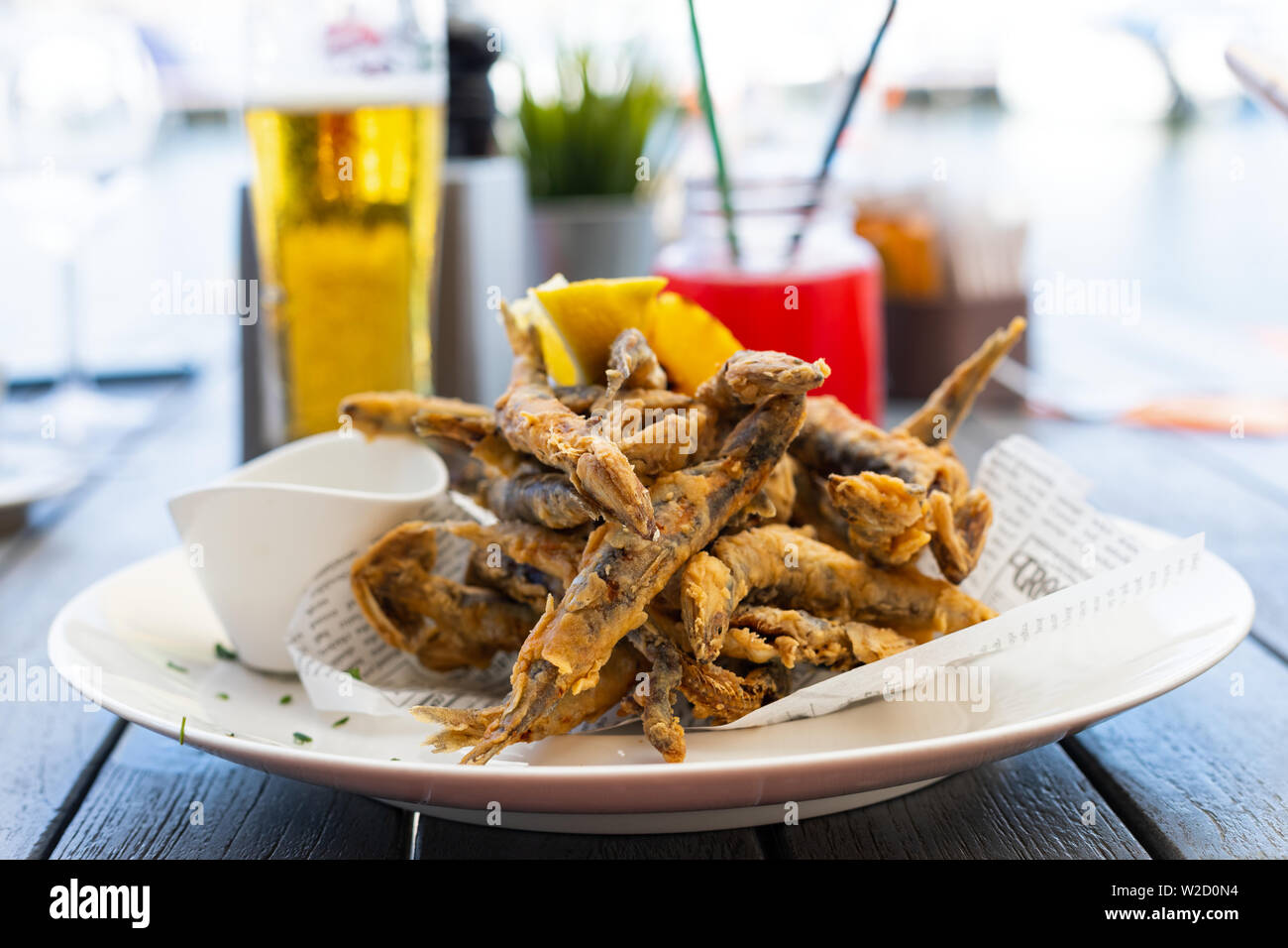 Crispy fried black sea anchovies (hamsi) with lemon and garlic sauce at ...