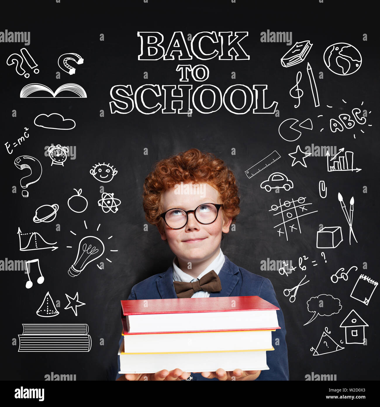 Little child pupil on chalkboard background. Back to school concept ...