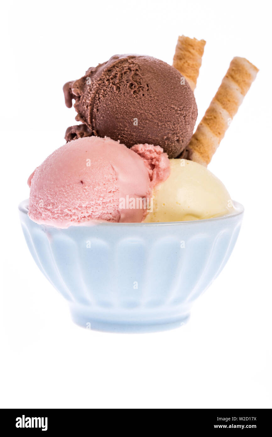 ice cream sundae: Three scoops of ice cream in blue china isolated on ...