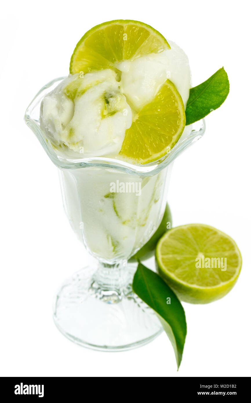 ice cream sundae: lemon ice cream sundae with lemon and leafes in front ...