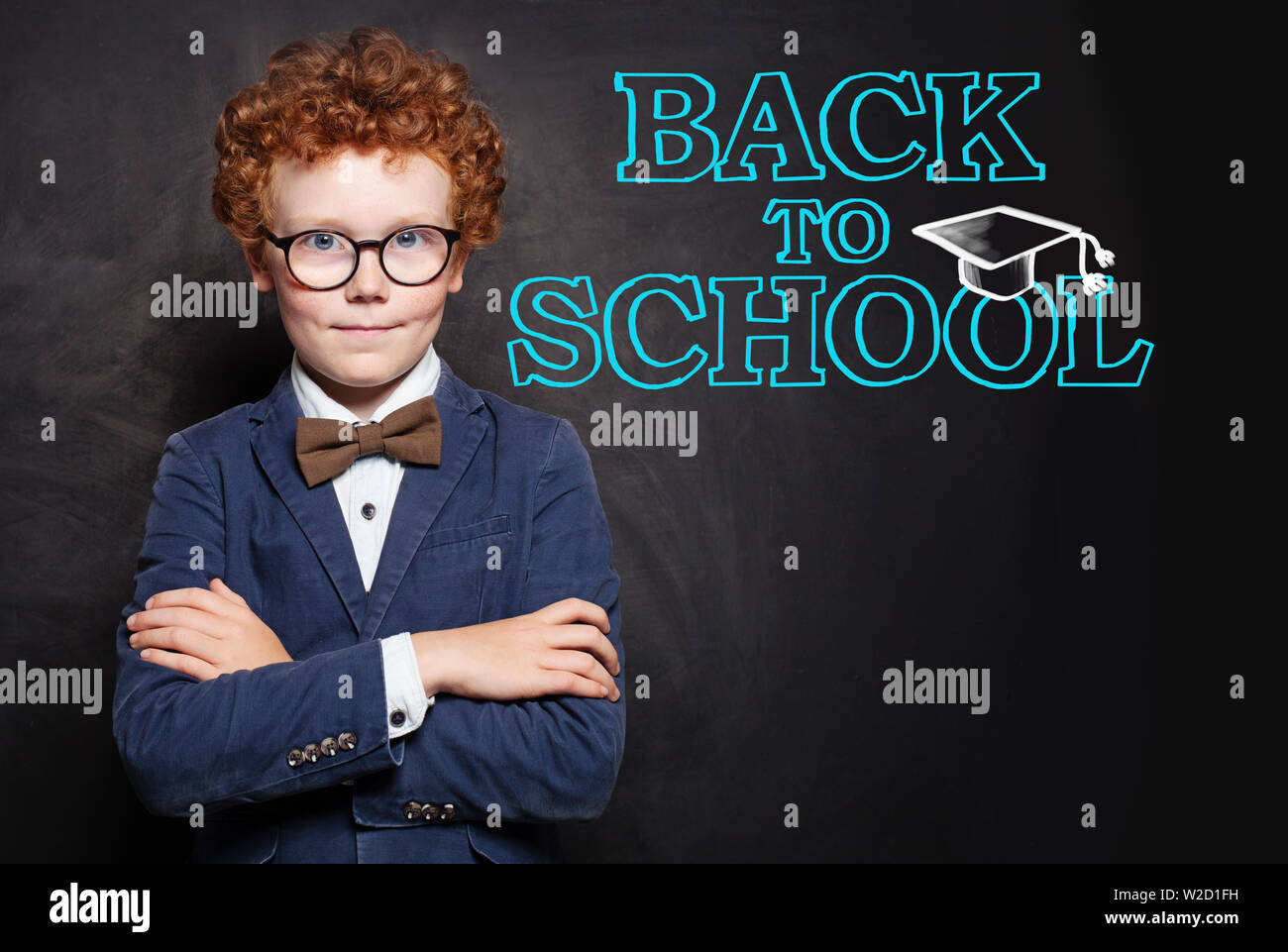 Successful child smart student boy on chalkboard background, back to ...