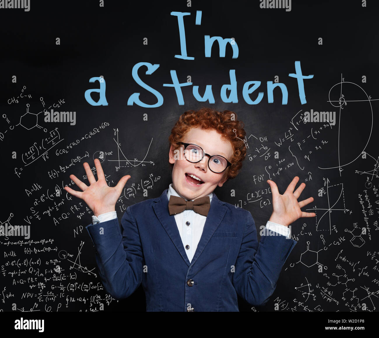 Little kid school student in classroom on chalkboard background Stock ...